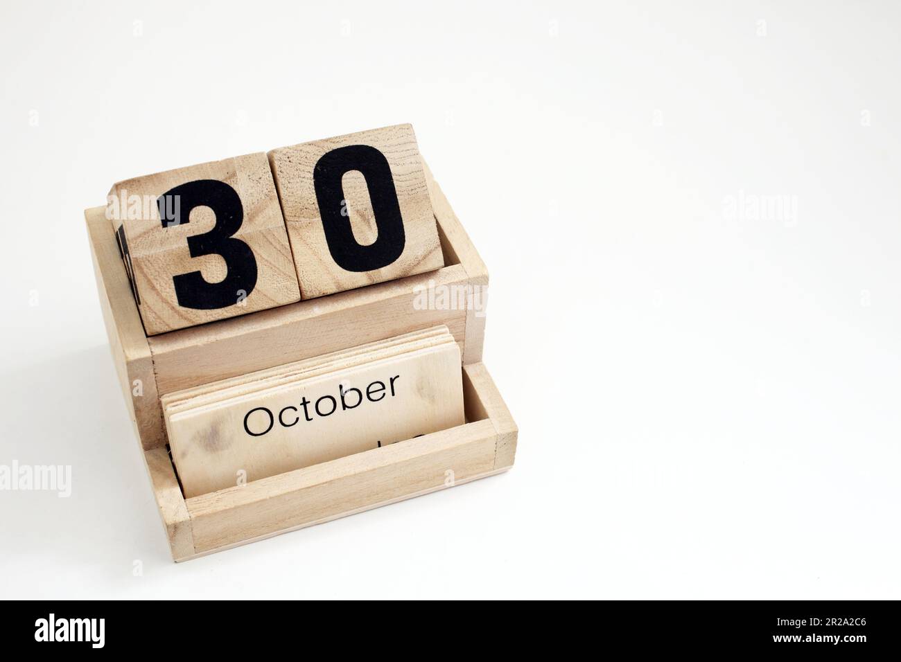 Wooden perpetual calendar showing the 30th of October Stock Photo - Alamy