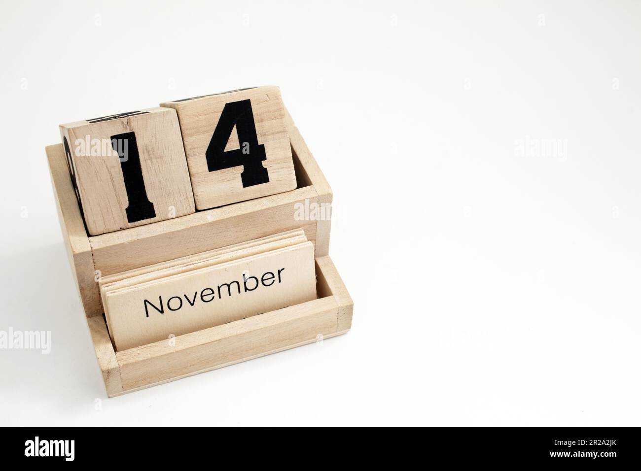 Wooden perpetual calendar showing the 14th of November Stock Photo - Alamy