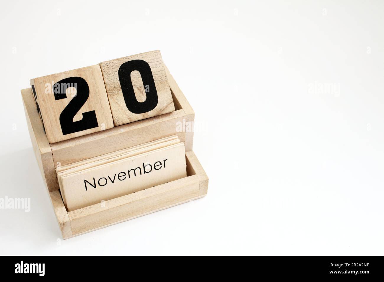 Wooden perpetual calendar showing the 20th of November Stock Photo - Alamy
