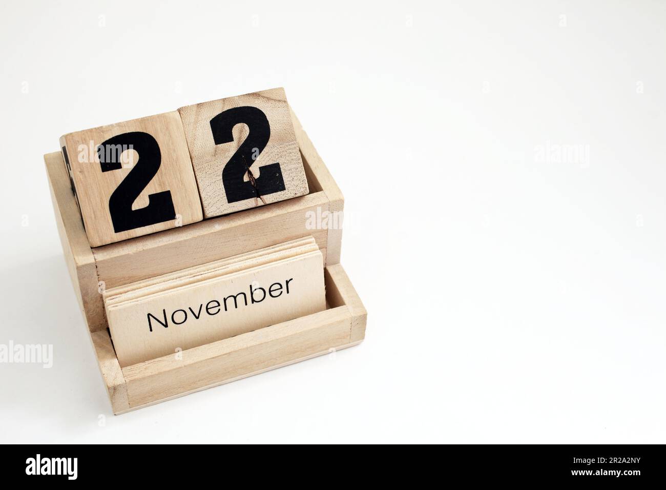 Wooden perpetual calendar showing the 22nd of November Stock Photo - Alamy