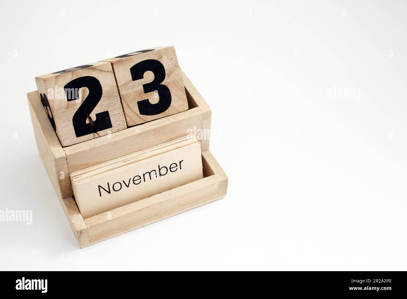 Wooden perpetual calendar showing the 23rd of November Stock Photo - Alamy