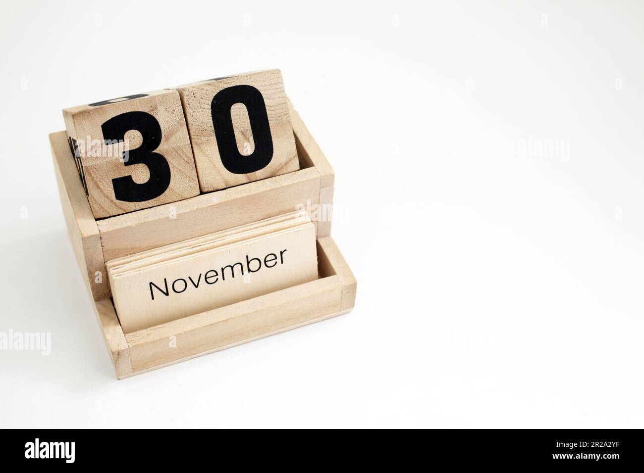 Wooden perpetual calendar showing the 30th of November Stock Photo - Alamy