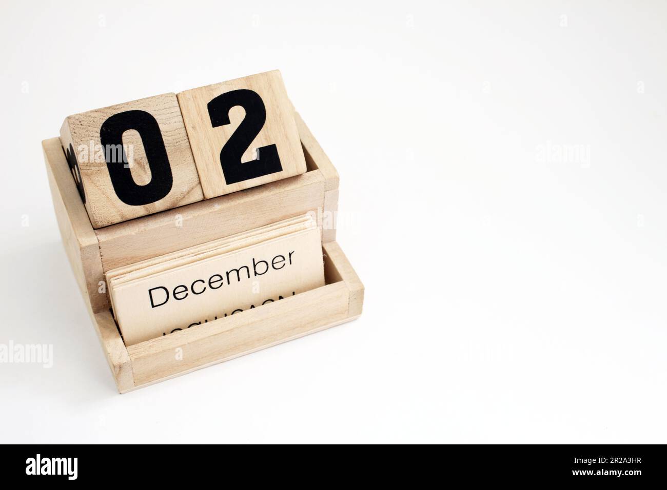 Wooden perpetual calendar showing the 2nd of December Stock Photo - Alamy