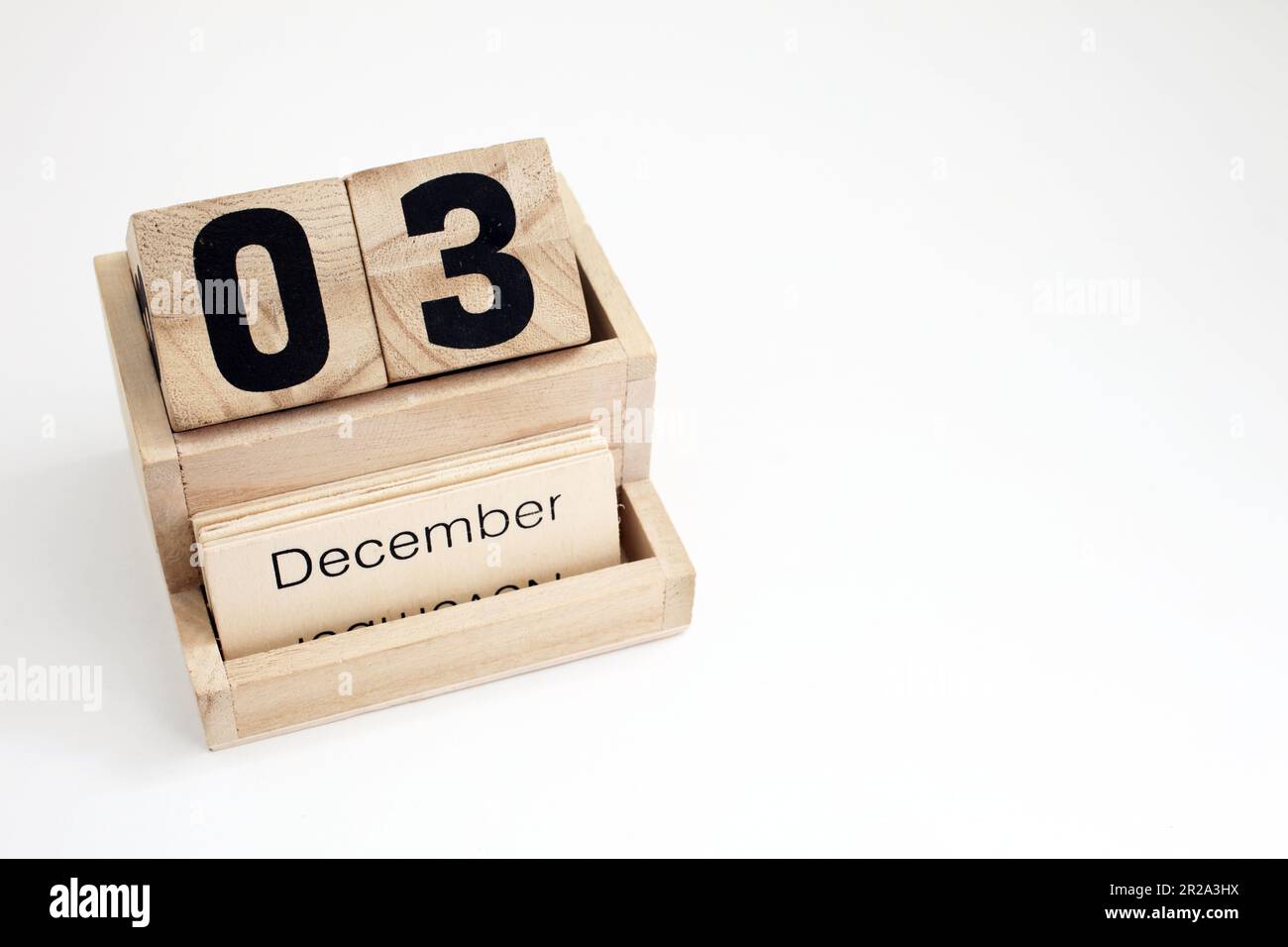 Wooden perpetual calendar showing the 3rd of December Stock Photo - Alamy