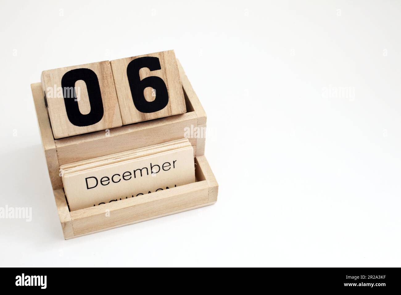 Wooden perpetual calendar showing the 6th of December Stock Photo - Alamy