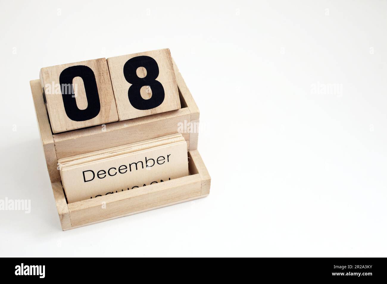 Wooden perpetual calendar showing the 8th of December Stock Photo - Alamy