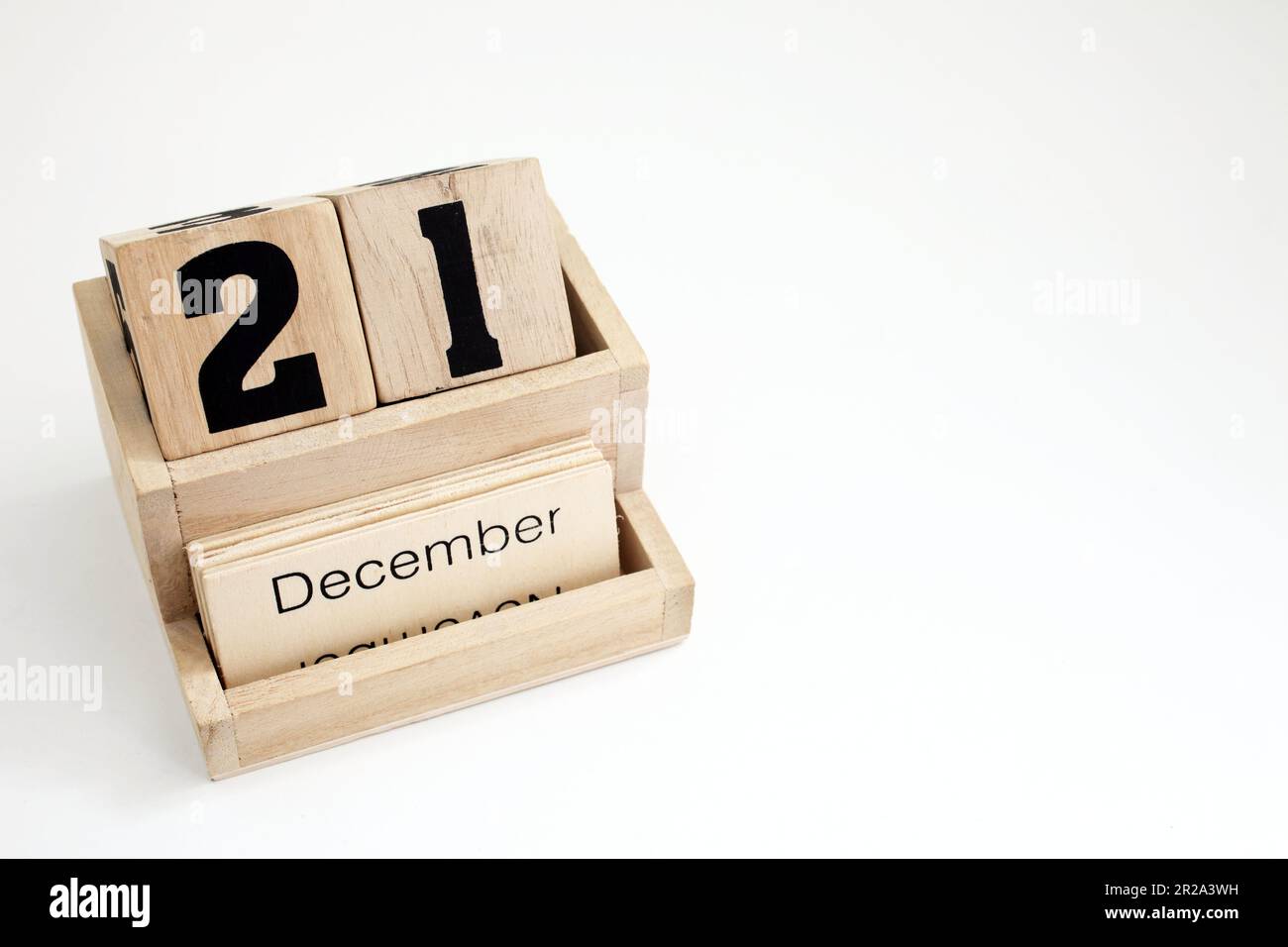 Wooden perpetual calendar showing the 21st of December Stock Photo - Alamy