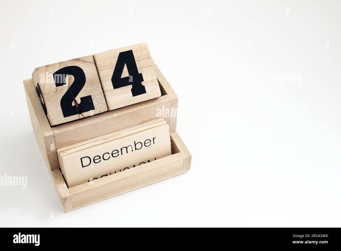 Wooden perpetual calendar showing the 24th of December Stock Photo - Alamy