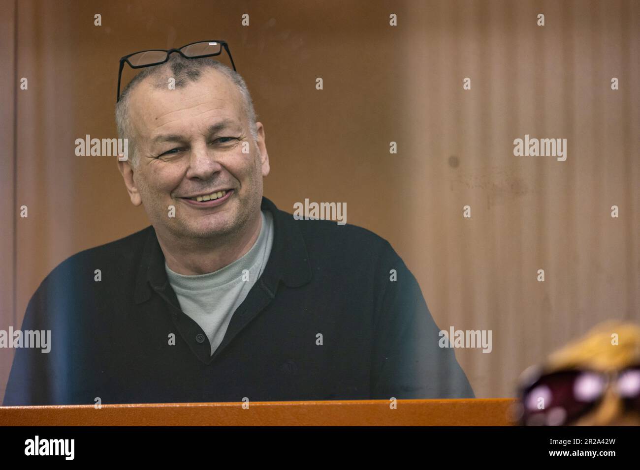 Russian opposition activist Mikhail Kriger in a glass cage during his ...
