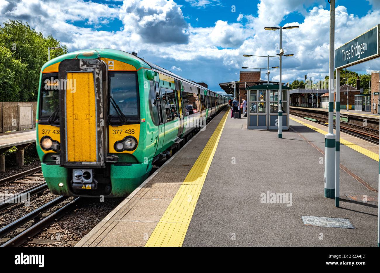 A Southern Railway train pulls into Three Bridges Railway Station in ...