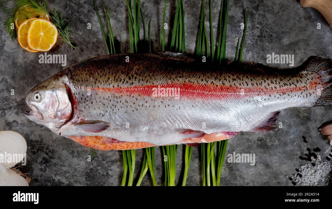 Cutting fresh fish before cooking Stock Photo - Alamy