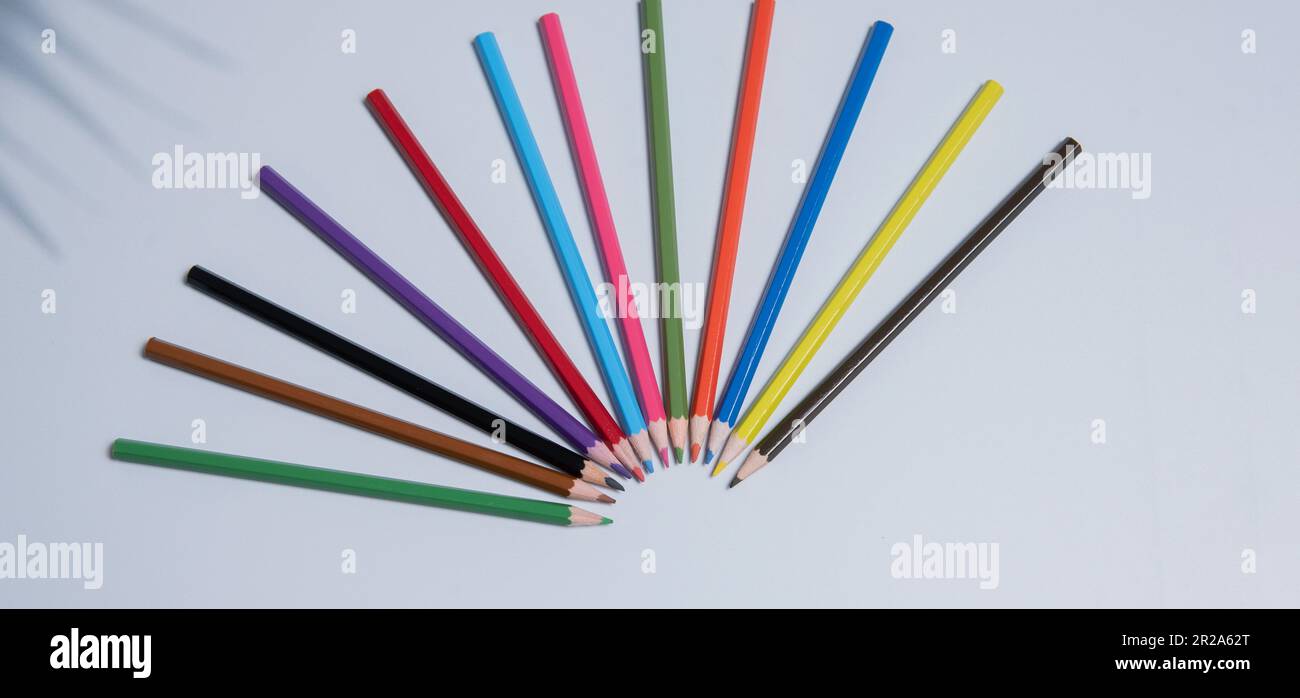 Colored pencils for drawing and coloring, on a white background ...