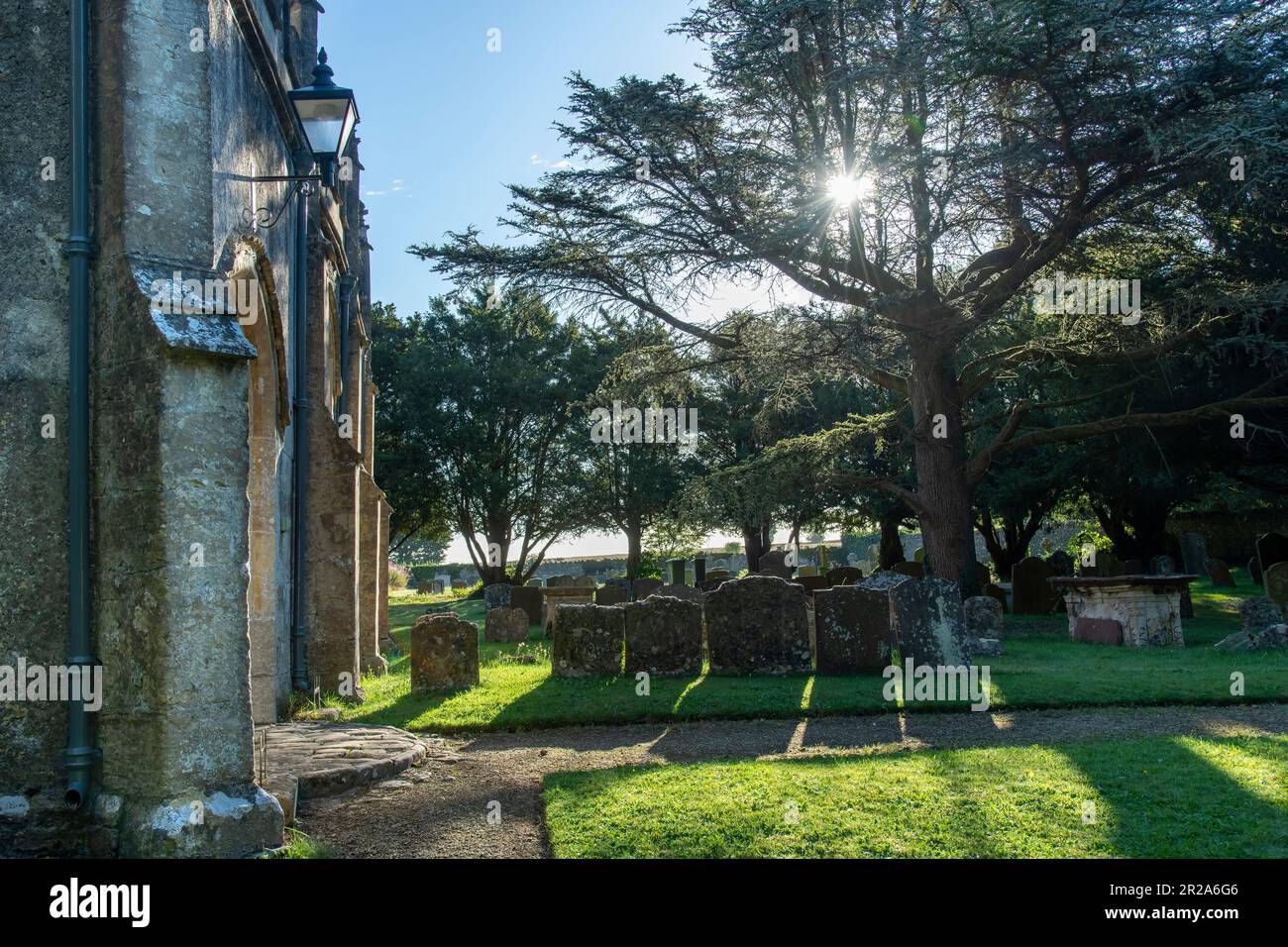 Side view of the Holy Trinity Church, Cold Ashton, UK along the public ...