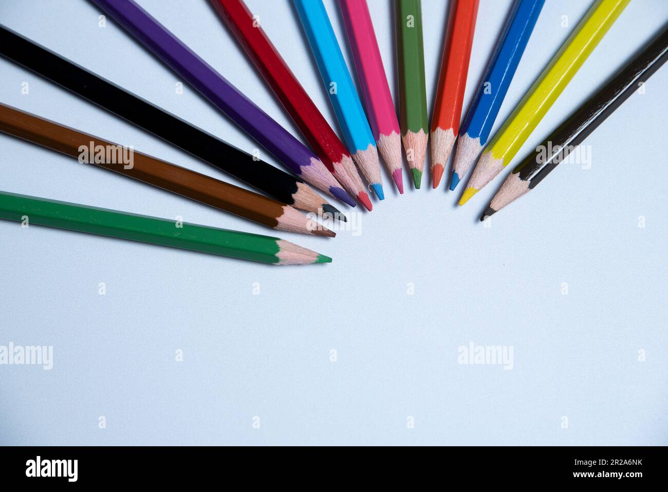 Colored pencils for drawing and coloring, on a white background ...