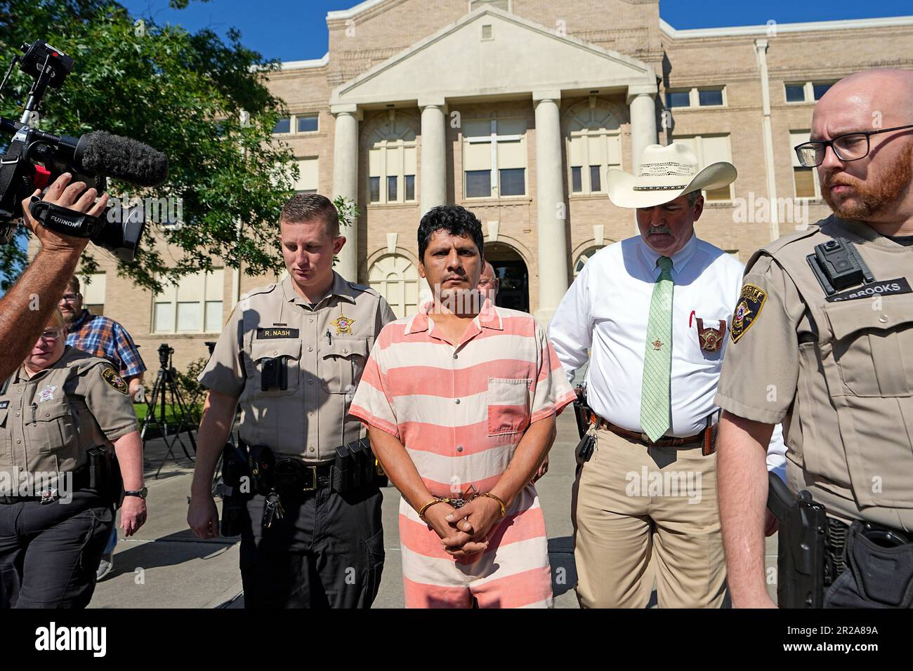 Francisco Oropeza, center, is escorted from the San Jacinto County ...