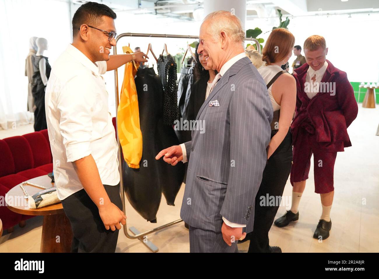 King Charles III, is shown the 'bubble' trousers worm by Sam Smith at ...