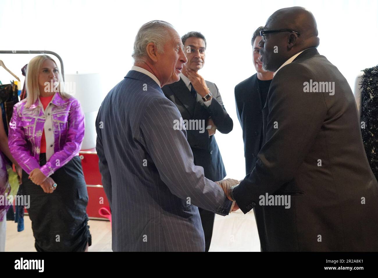 King Charles III greets Edward Enninful, editor-in-chief of British ...