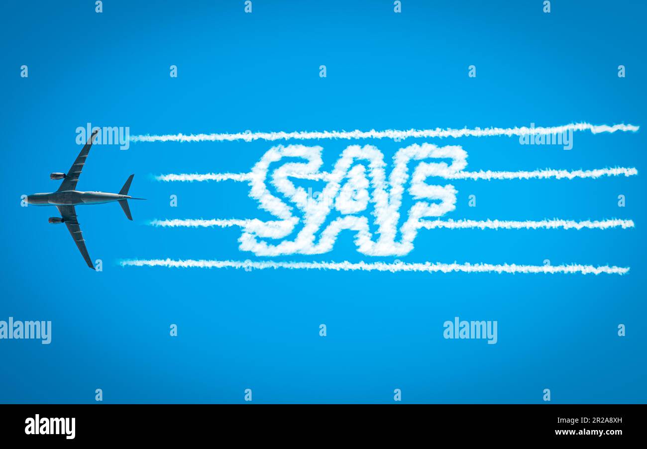 Airplane leaving jet contrails with SAF word inside. Concept of ...