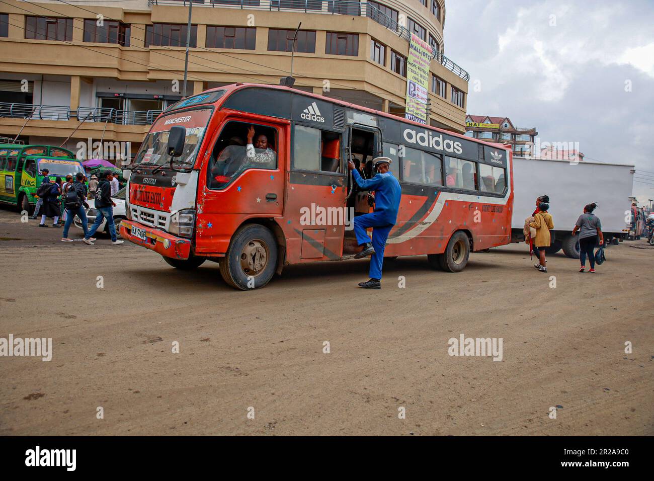 A traffic police officer boarding a bus in Nairobi Central Business ...