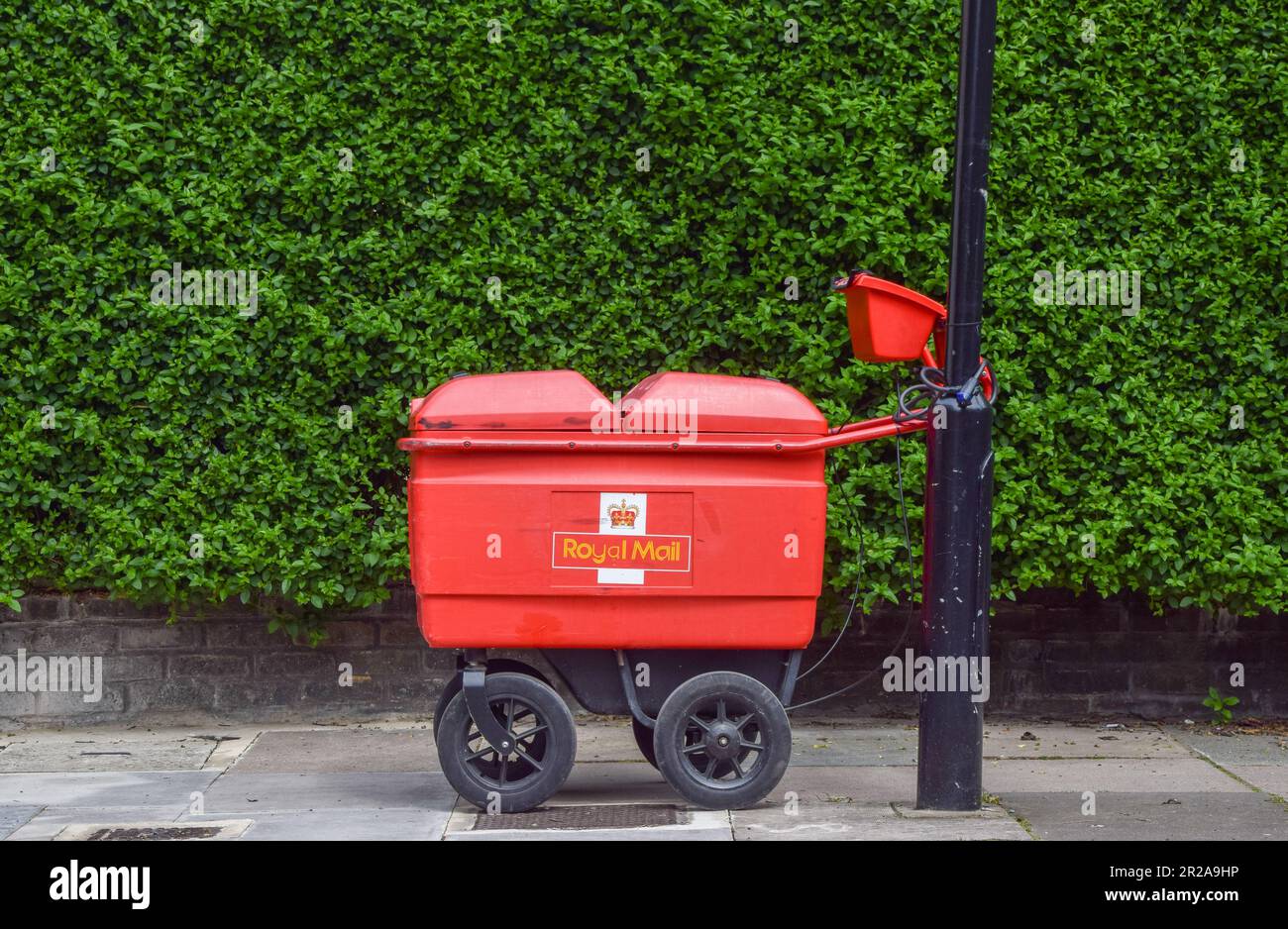 London, UK - 18th May 2023: A Royal Mail delivery cart parked on a ...