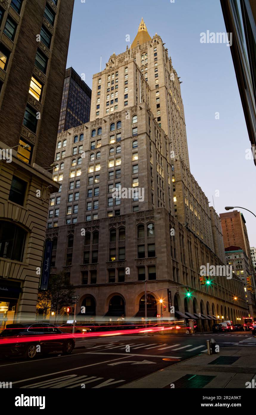 Early morning traffic leaves light trails past the New York Life ...