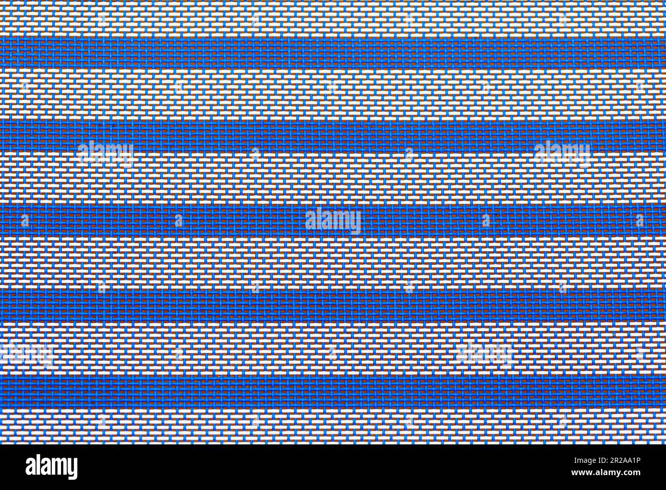 Blue and white plastic thread fabric. The threads are intertwined ...