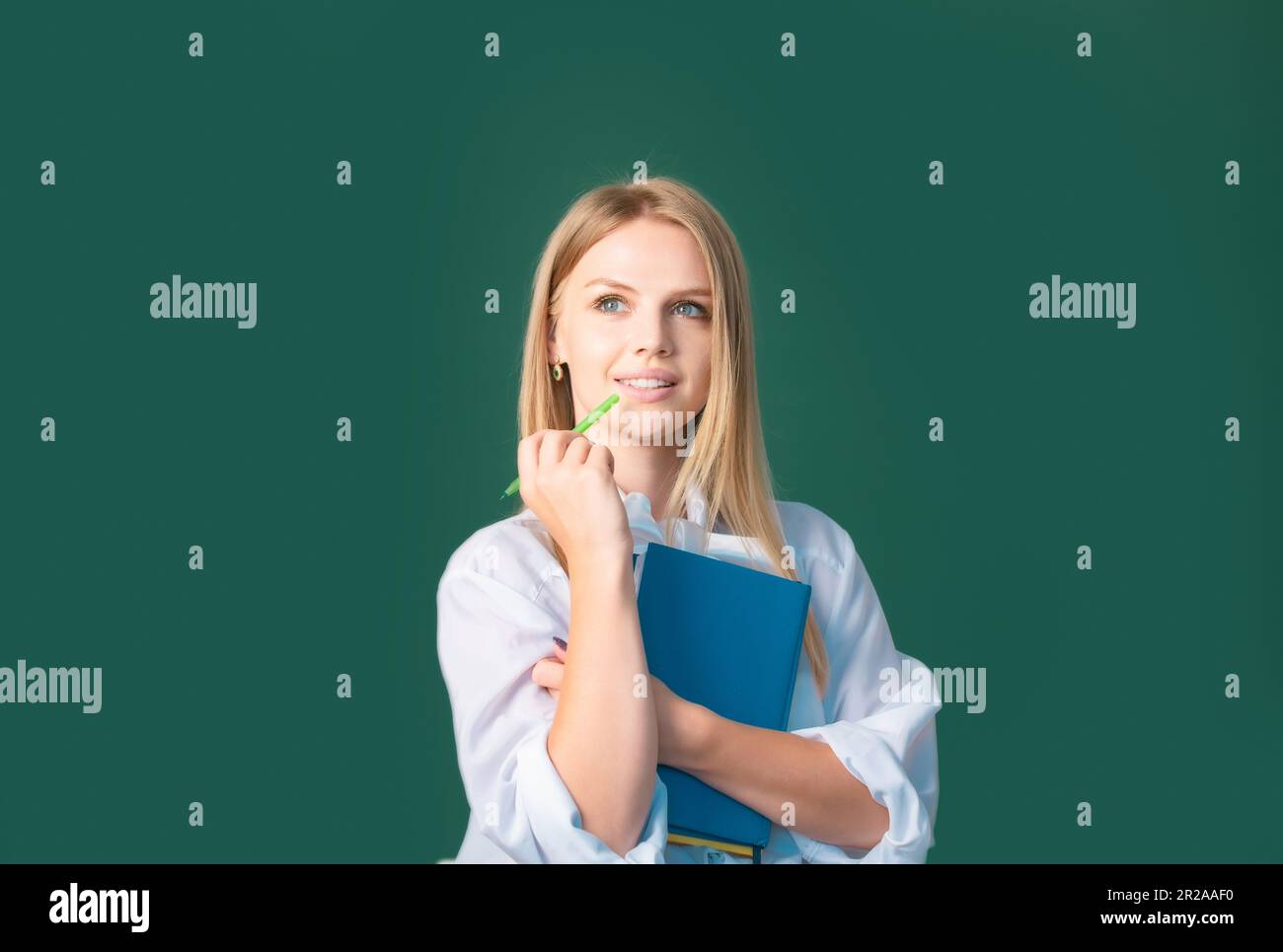 Portrait of a young, confident and attractive female student studying ...