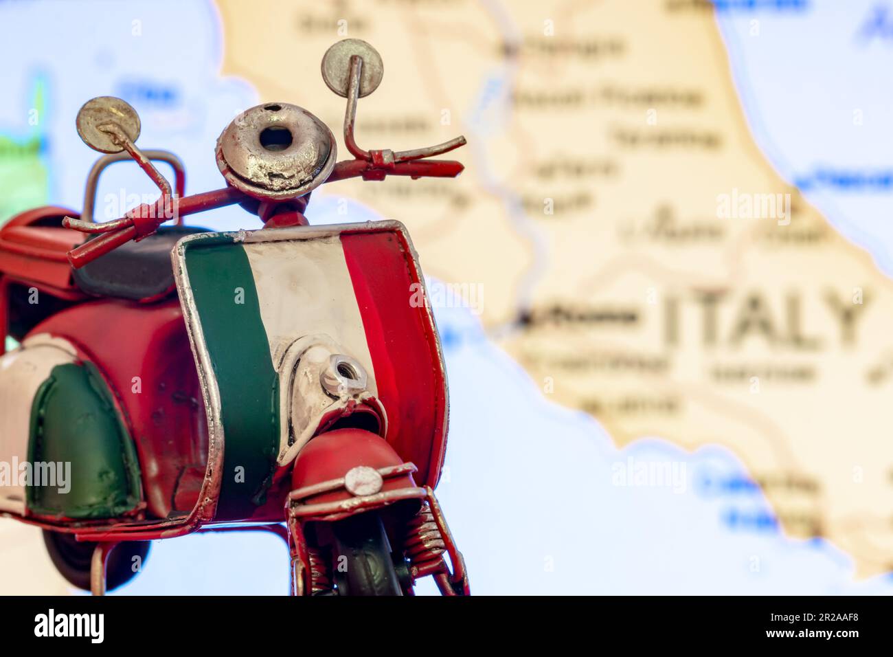 Visit Italy concept with motor scooter against an Italy map Stock Photo ...