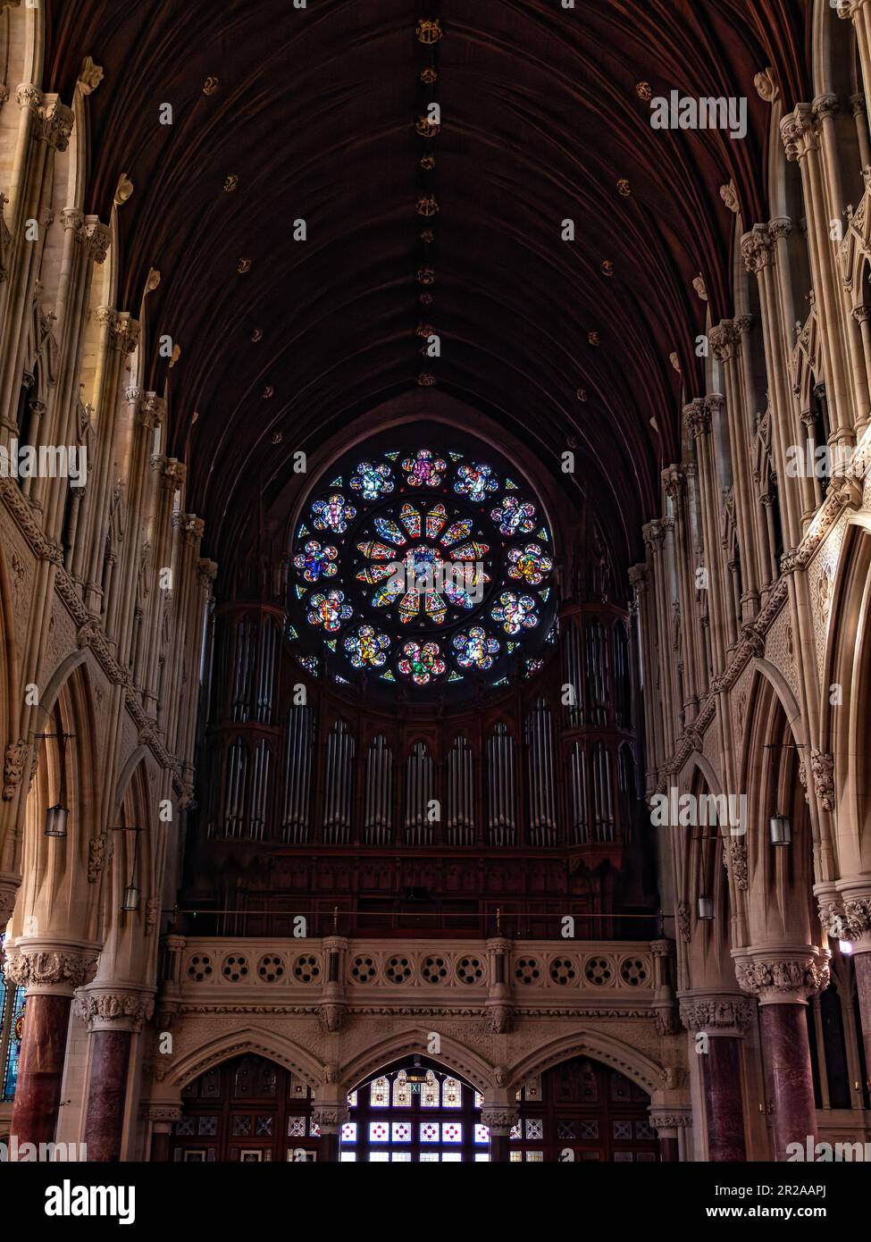 A large multicolored stained glass window in the Roman Catholic Church ...