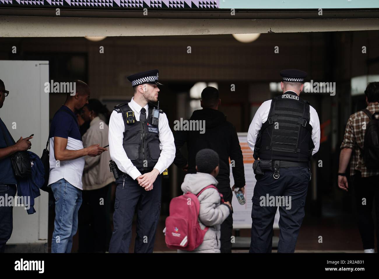 Police officers at West Croydon train station in South London ...