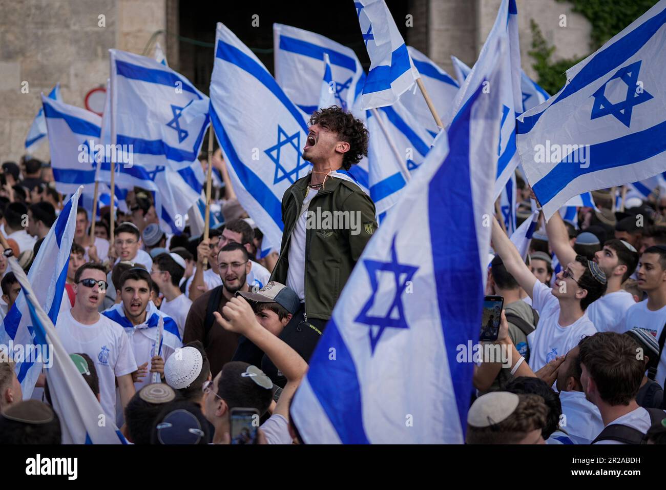 Israelis dance and wave national flags during a march marking Jerusalem ...