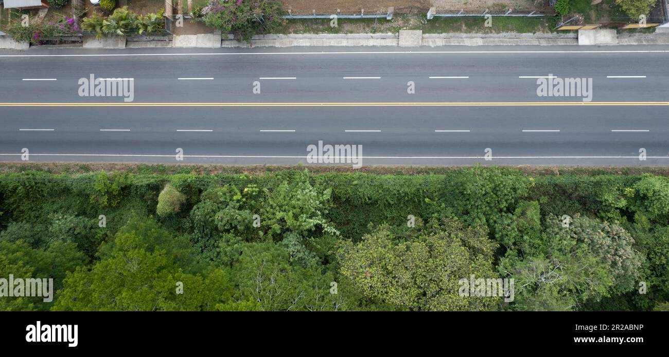 Highway next to residential houses above top drone view Stock Photo - Alamy
