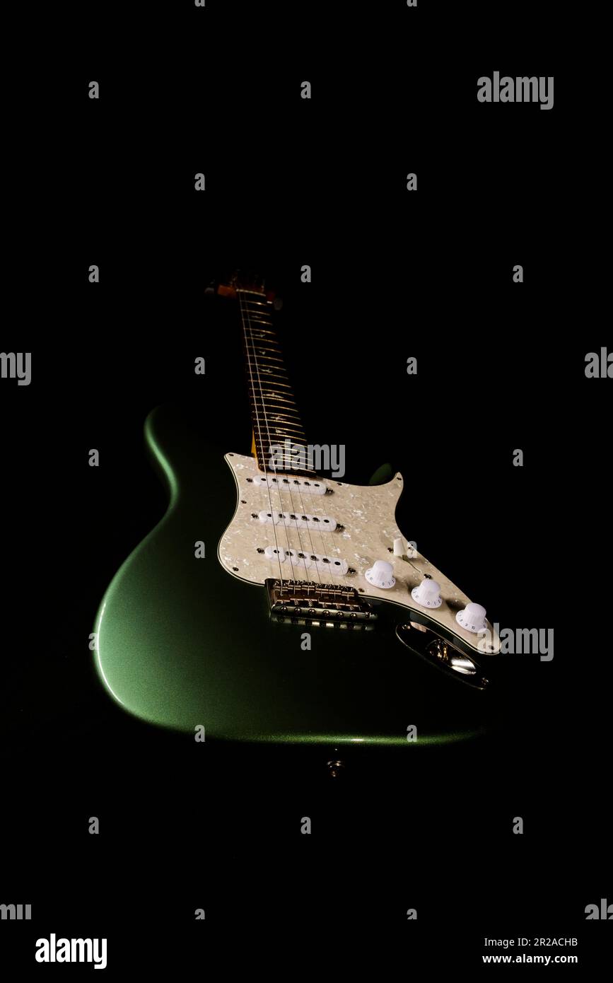 Stratocaster style electric guitar floating on black background Stock ...