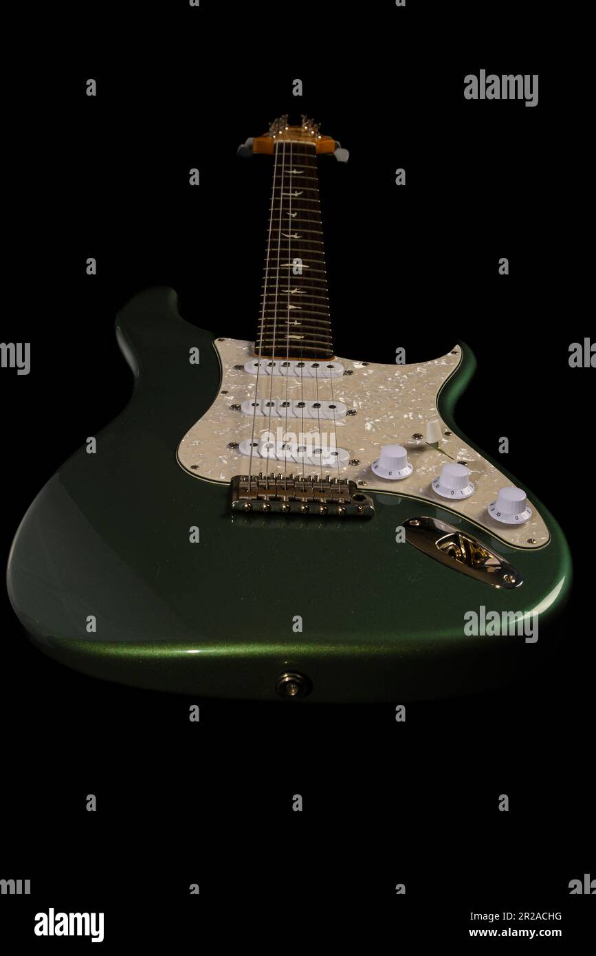 Stratocaster style electric guitar floating on black background Stock ...