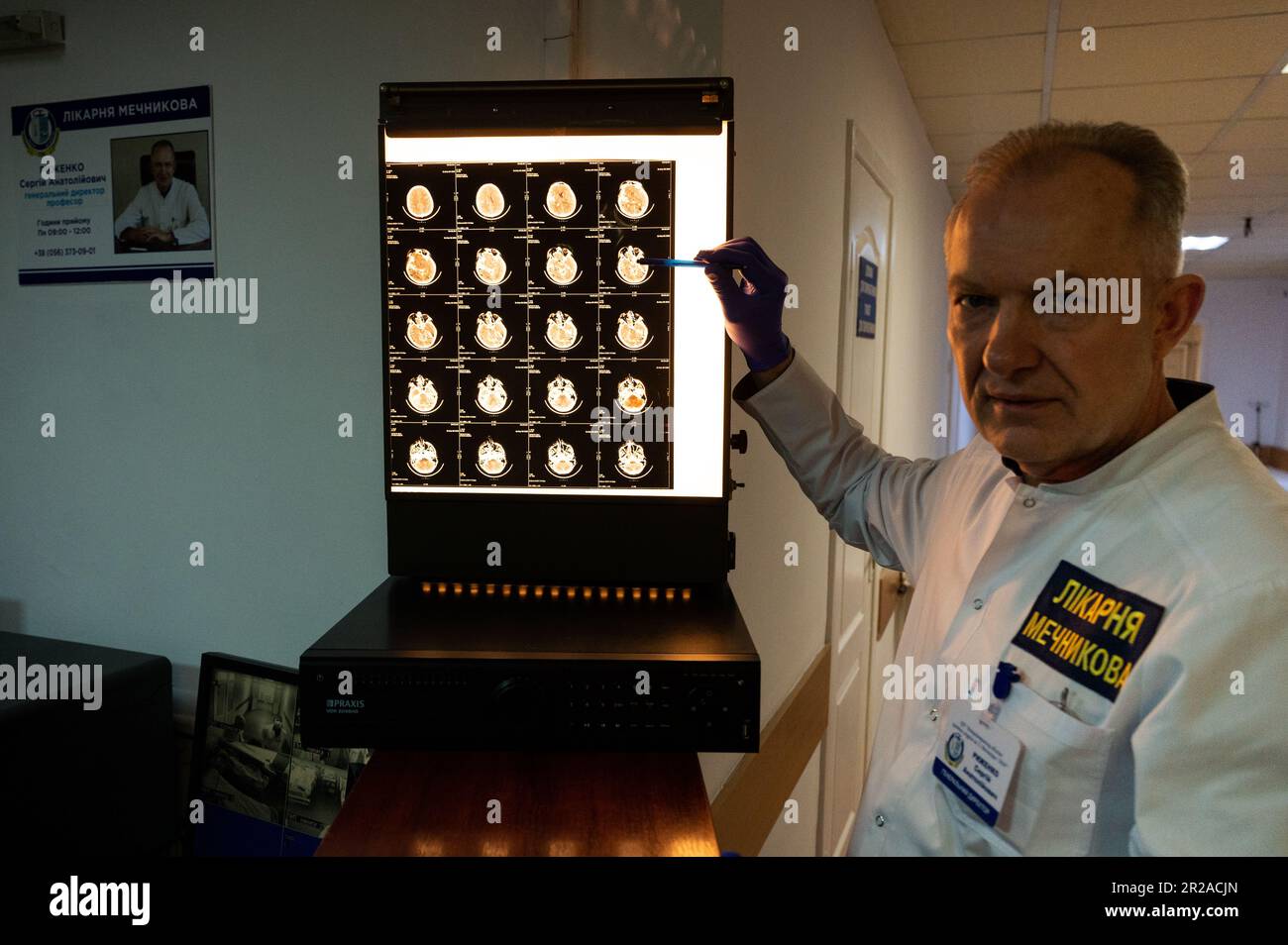 Dnipro, Ukraine. 14th May, 2023. Dr. Sergii Ryzhenko pointing to pieces ...