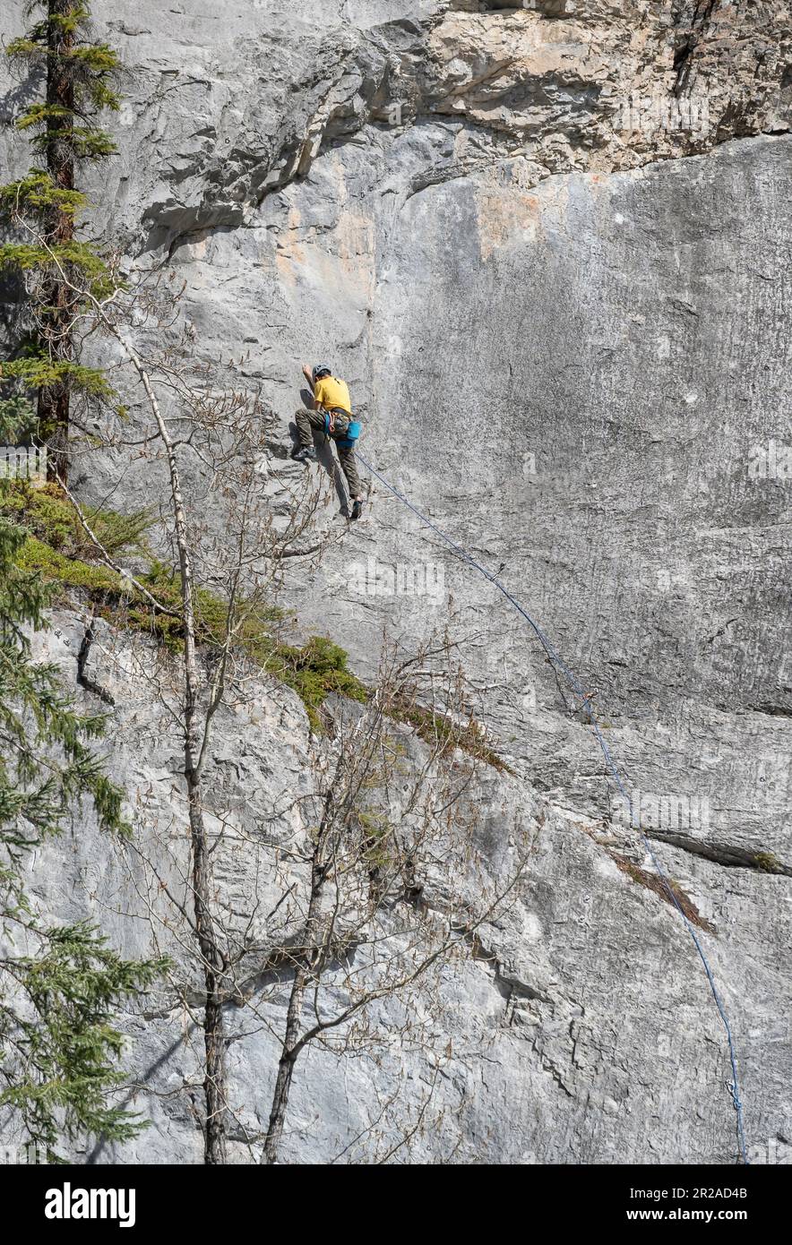 Unrecognizable rock climber on a cliff in Banff National Park, Alberta ...
