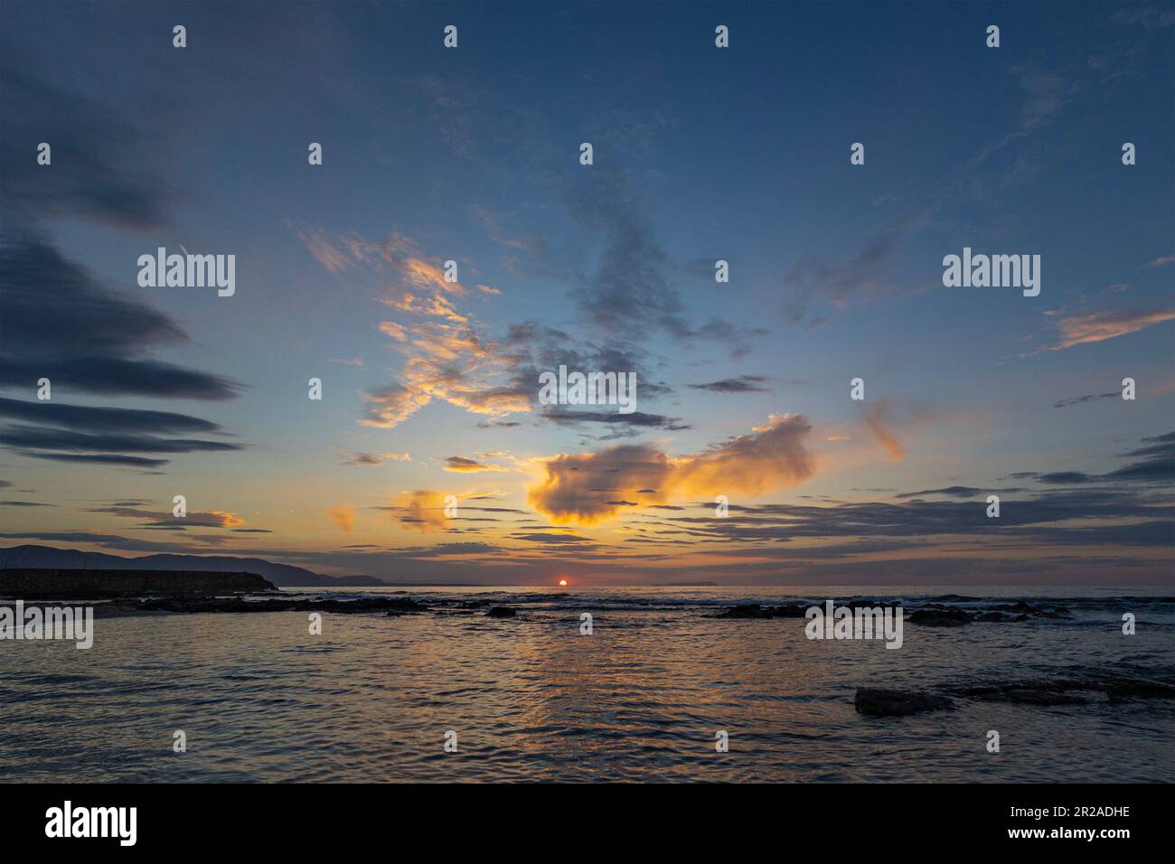 Sunset sky over Malia Bay, Sisi, Crete, Greece Stock Photo - Alamy