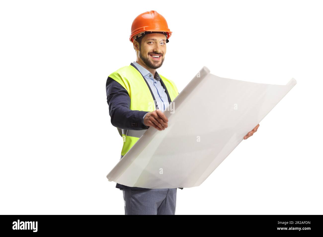 Engineer holding a blueprint and looking at camera isolated on white ...