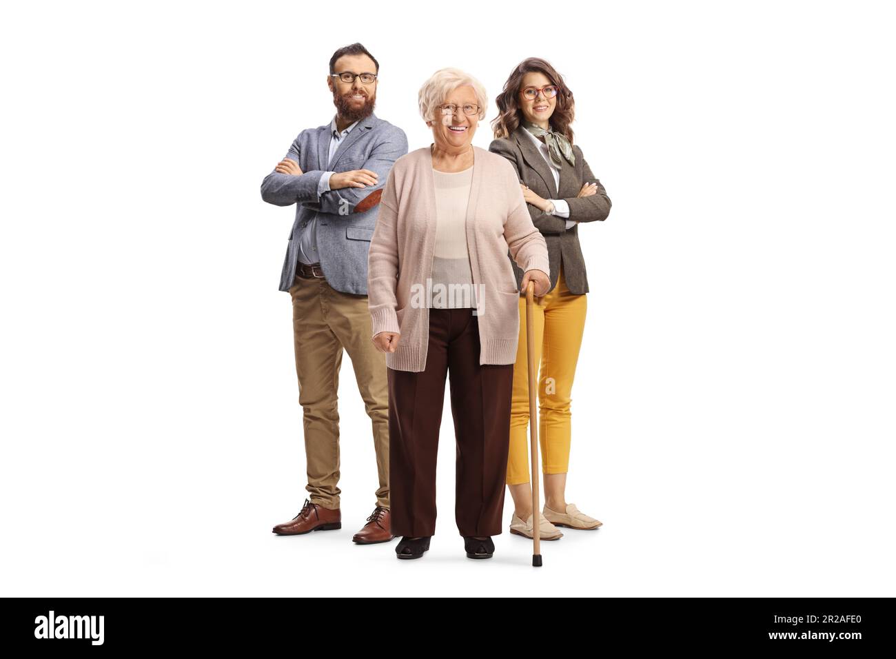 Elderly woman standing in front of a young man and woman isolated on ...