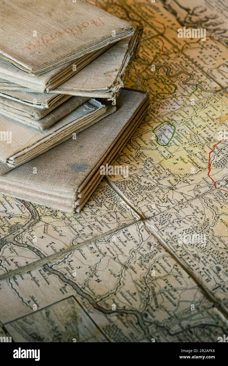 Ancient topographic maps on a table Stock Photo - Alamy
