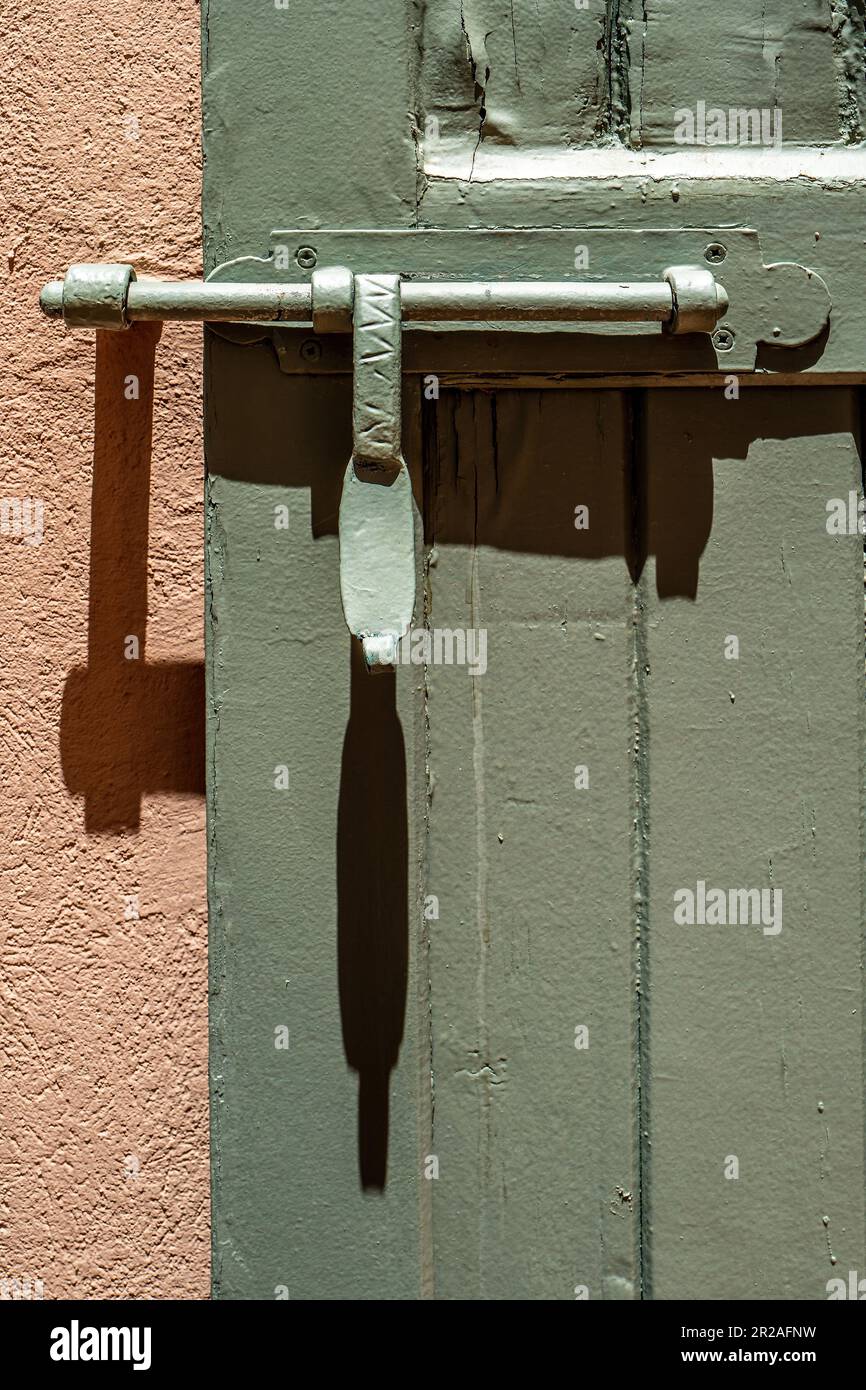 Closeup detail of carved metal lock on a door of a restored traditional ...