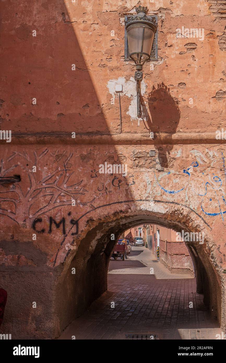 Ancient stone archway with a lamp in the Kasbah district of Marrakech ...