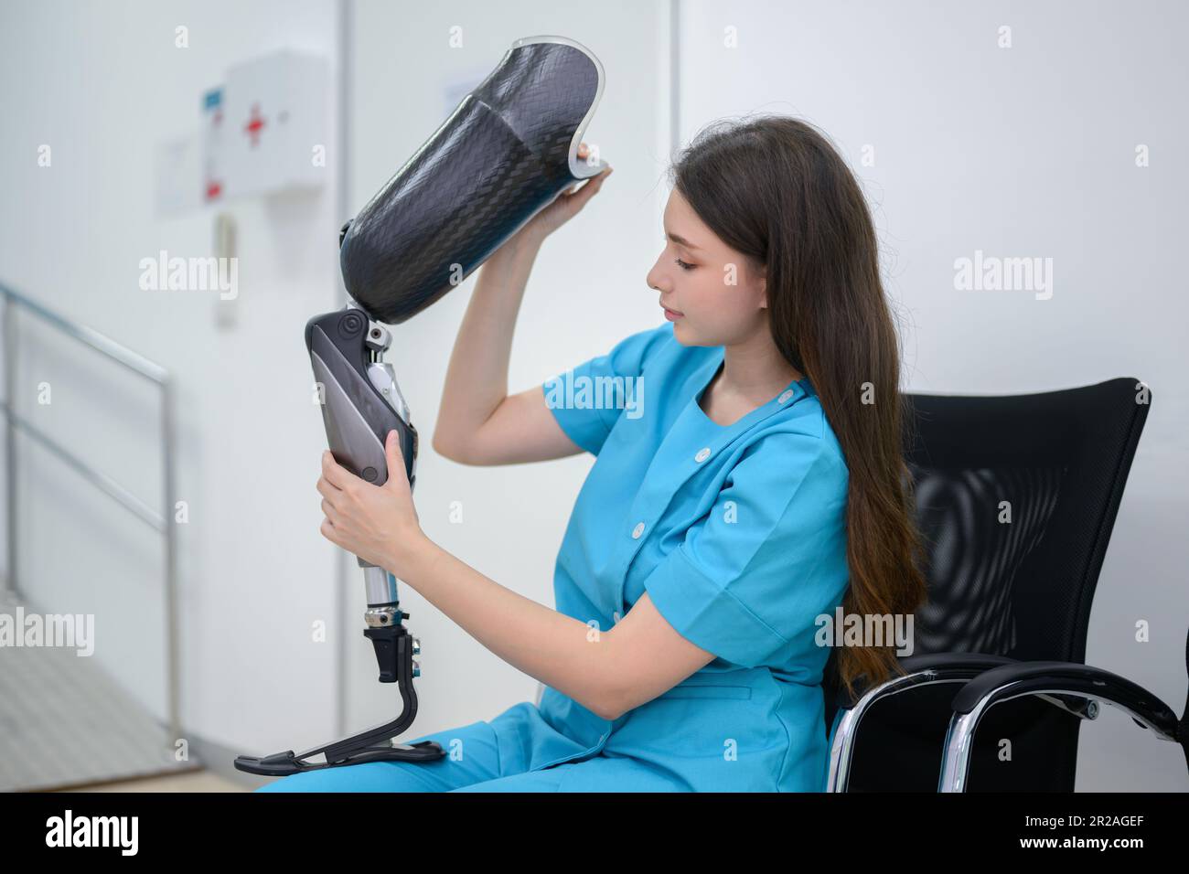 Prosthetic technician holding prosthetic leg checking and controlling ...