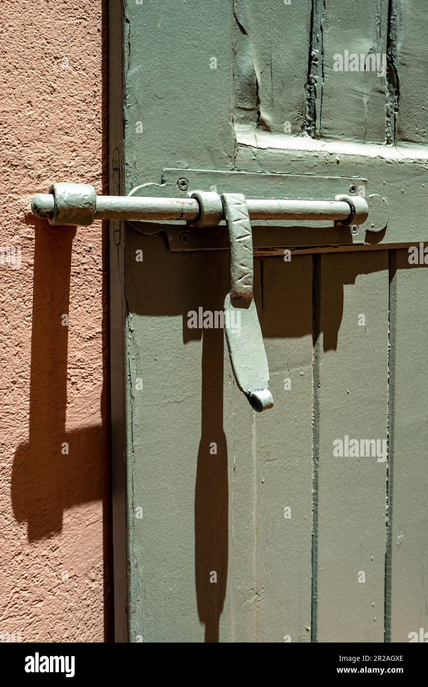 Closeup detail of carved metal lock on a door of a restored traditional ...