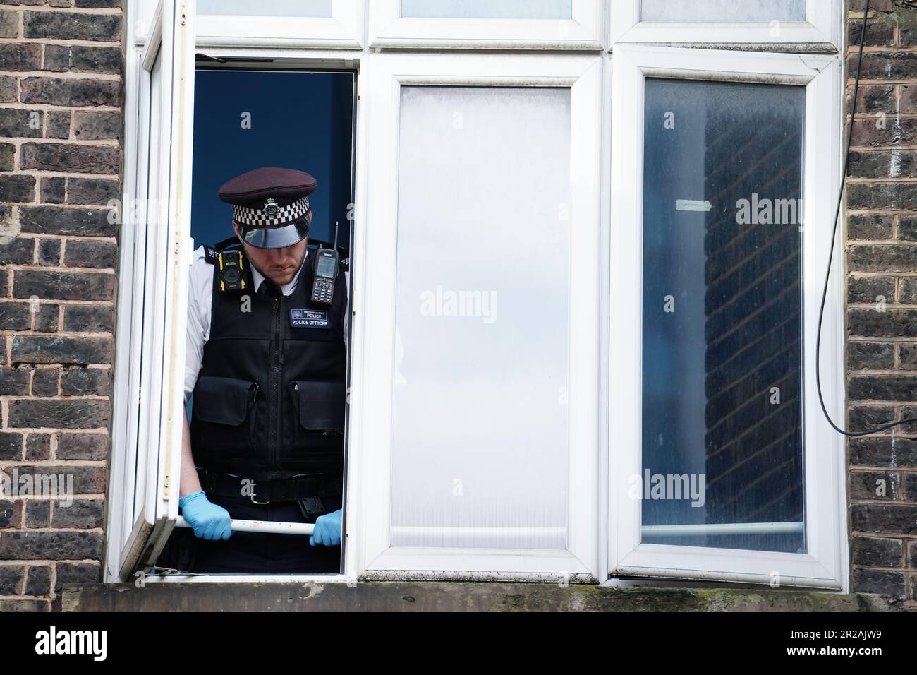 Police officers performing a weapons sweep as part of operational ...