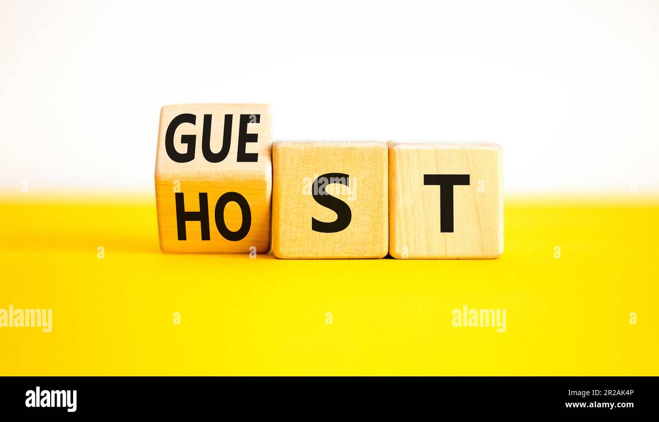 Guest and host symbol. Businessman turns wooden cubes and changes the ...