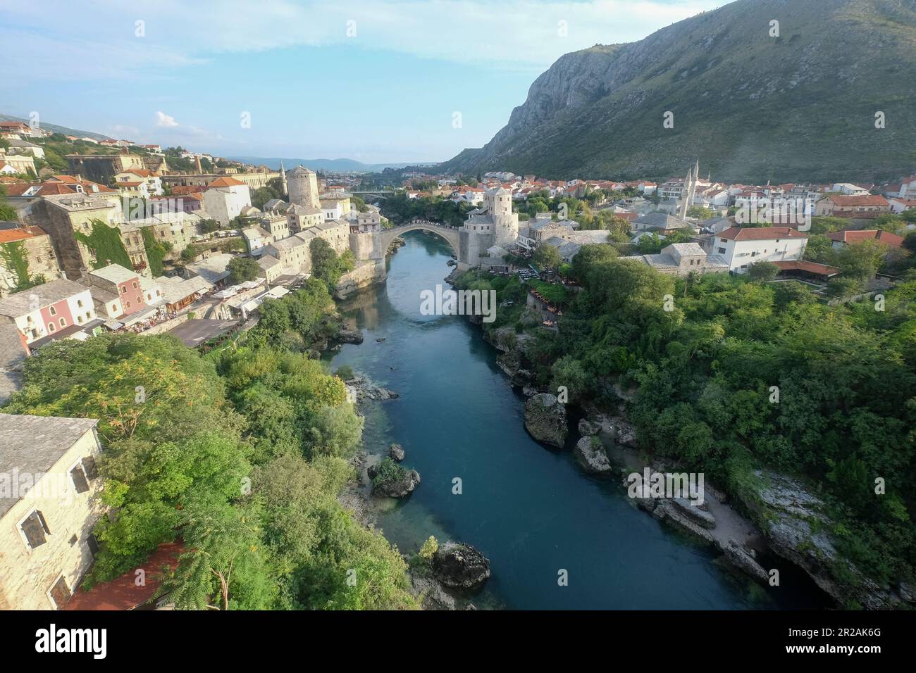 Skyline of Mostar with the Mostar Bridge, houses and minarets, at the ...