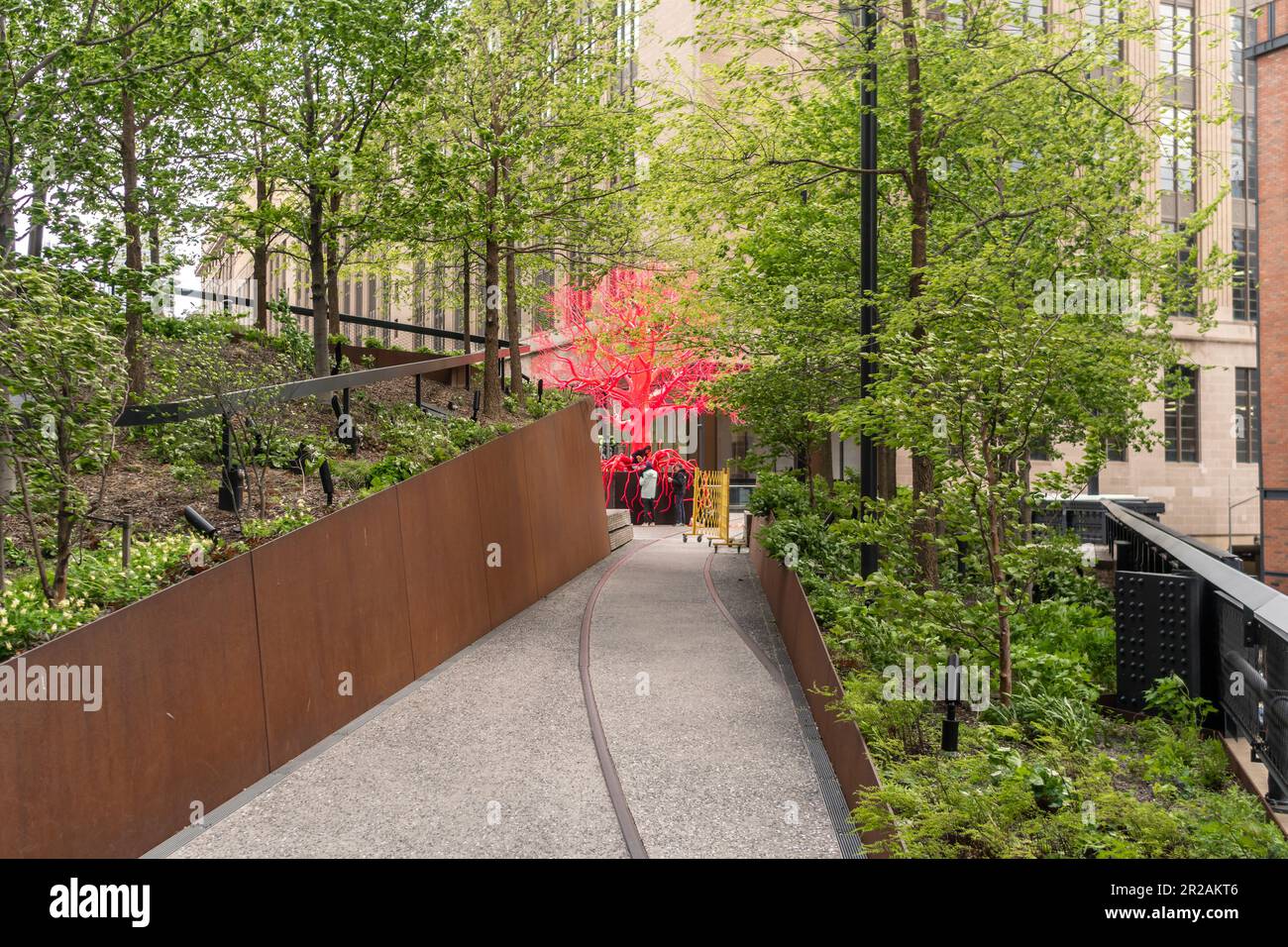 Workers continue the final installation of “Old Tree” by the artist ...
