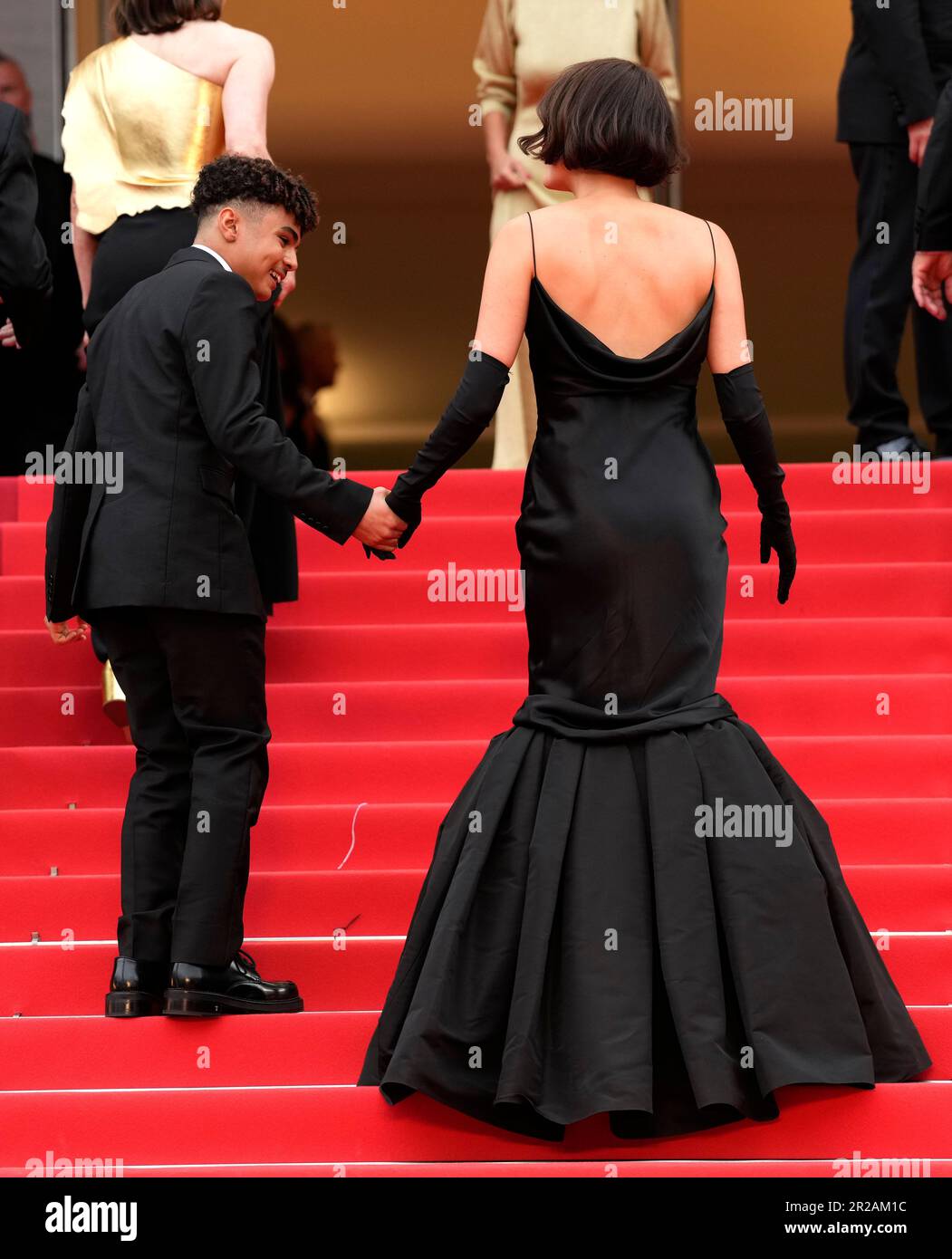 Ethann Isidore, left, and Phoebe Waller-Bridge pose for photographers ...
