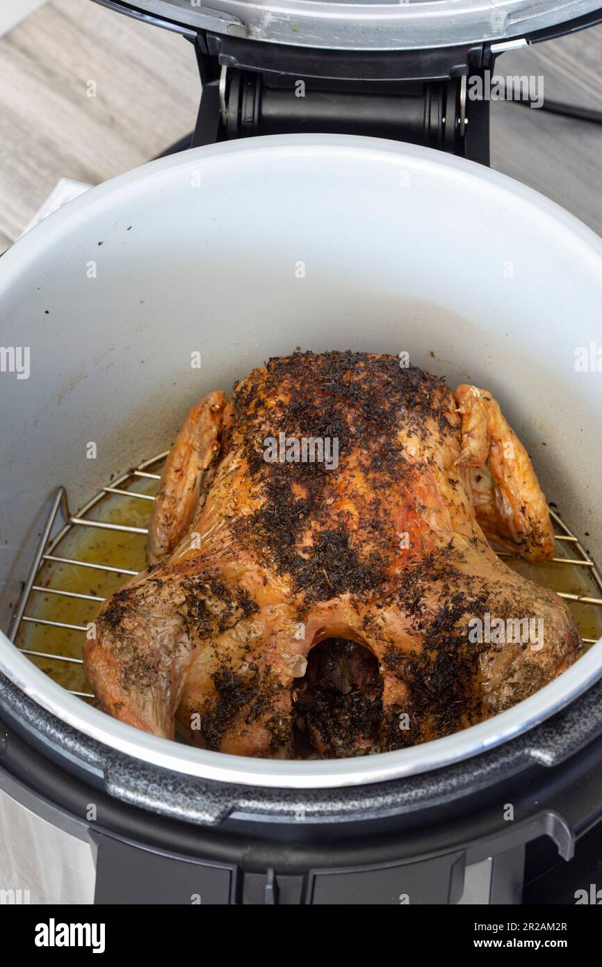 Chicken covered with mixed herbs cooked in an air fryer. Healthy low ...